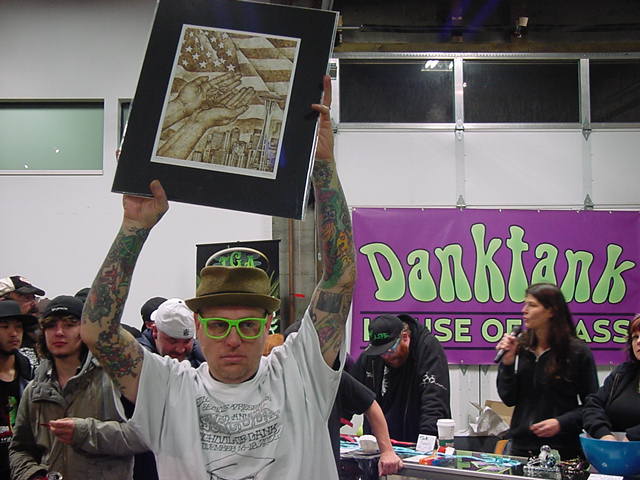 Jinxproof holding a raffle prize donated by Cliff Maynard